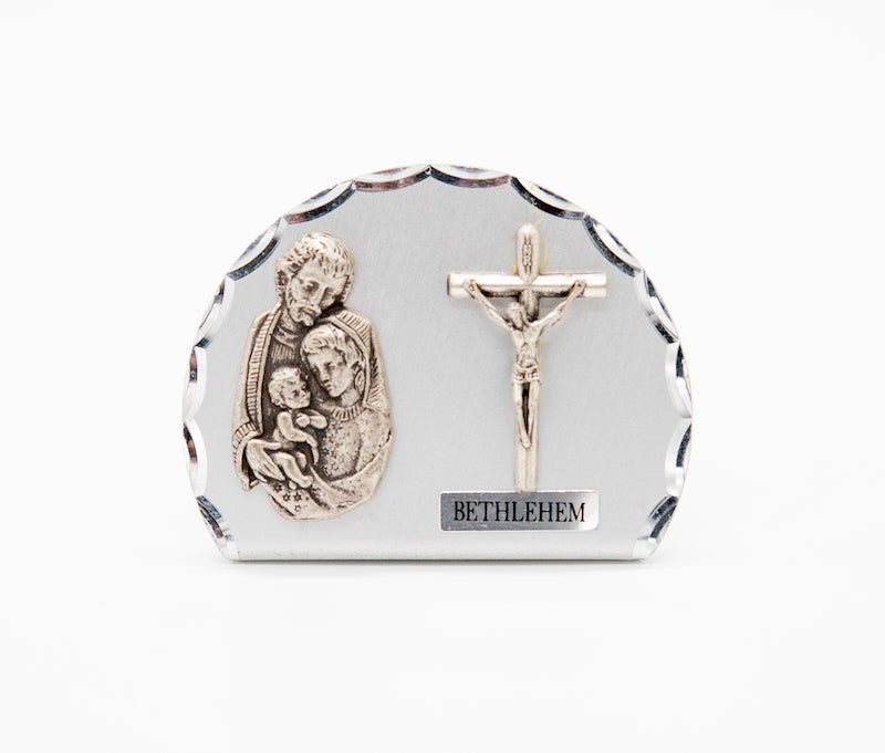 Metallic half-circle stand with a cross and a holy family icon ...